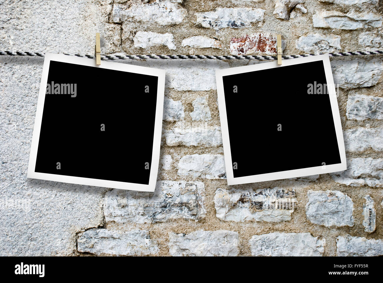 Vintage photos on a rope Stock Photo - Alamy