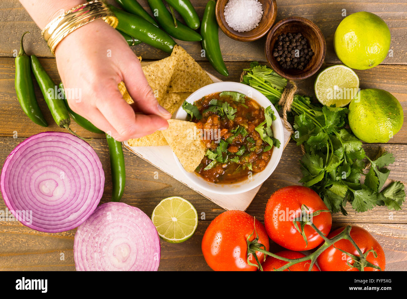 Fresh salsa in white bowl with ingredients Stock Photo - Alamy
