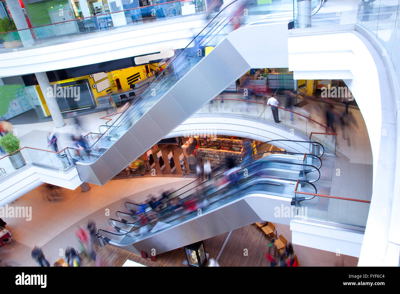 People in rush in shopping mall, centre Stock Photo - Alamy