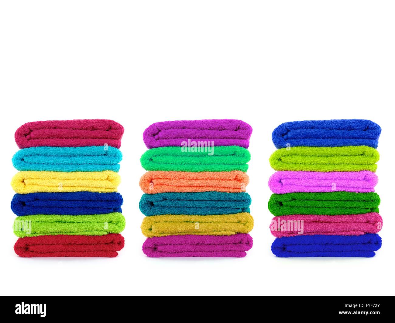 Colored towels isolated against a white background Stock Photo - Alamy
