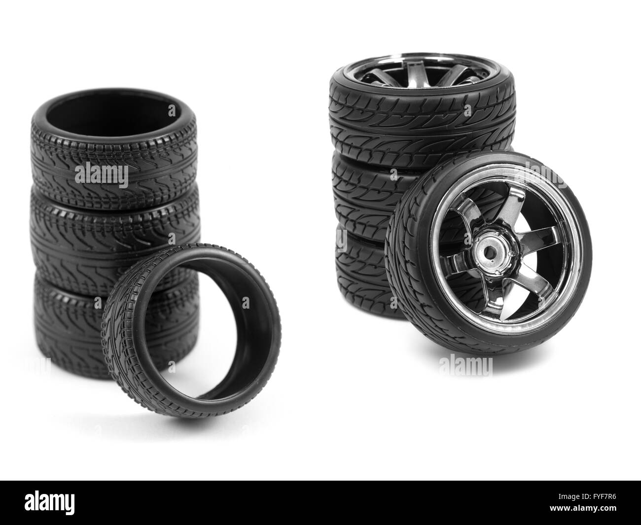 Rubber tyres with sports rims on a white background Stock Photo - Alamy
