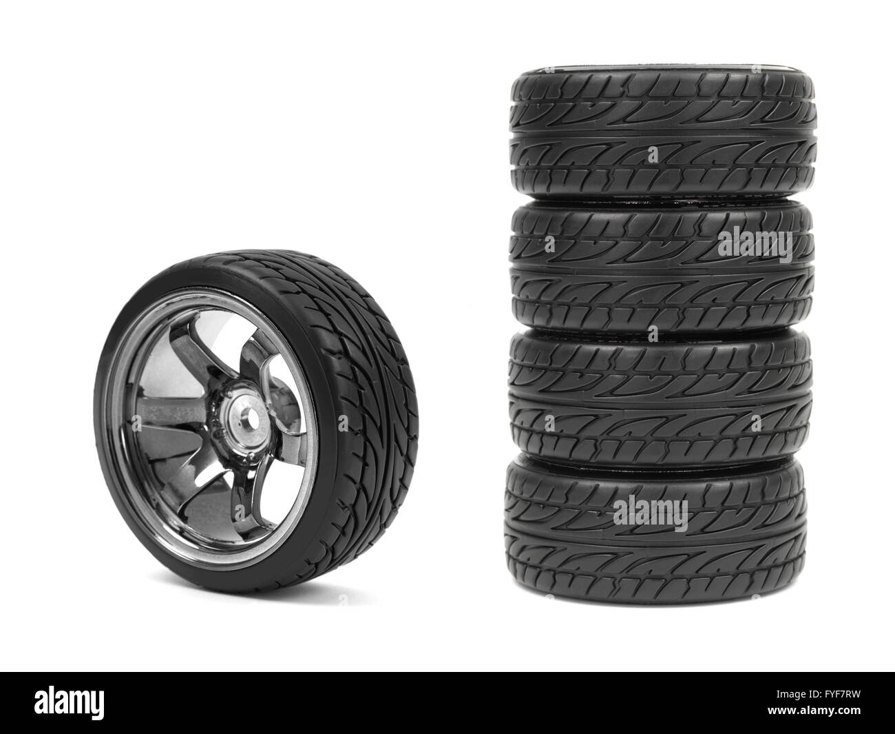 Rubber tyres with sports rims on a white background Stock Photo - Alamy