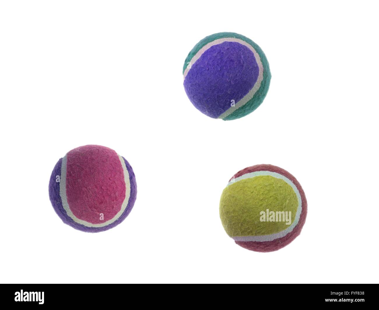 Sporting tennis balls on artificial green grass Stock Photo - Alamy