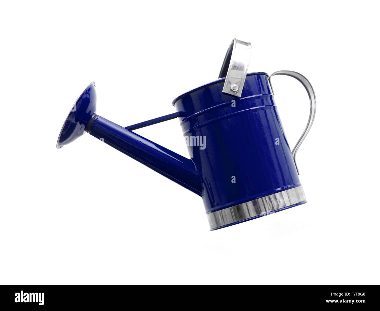 A watering can isolated against a white background Stock Photo - Alamy