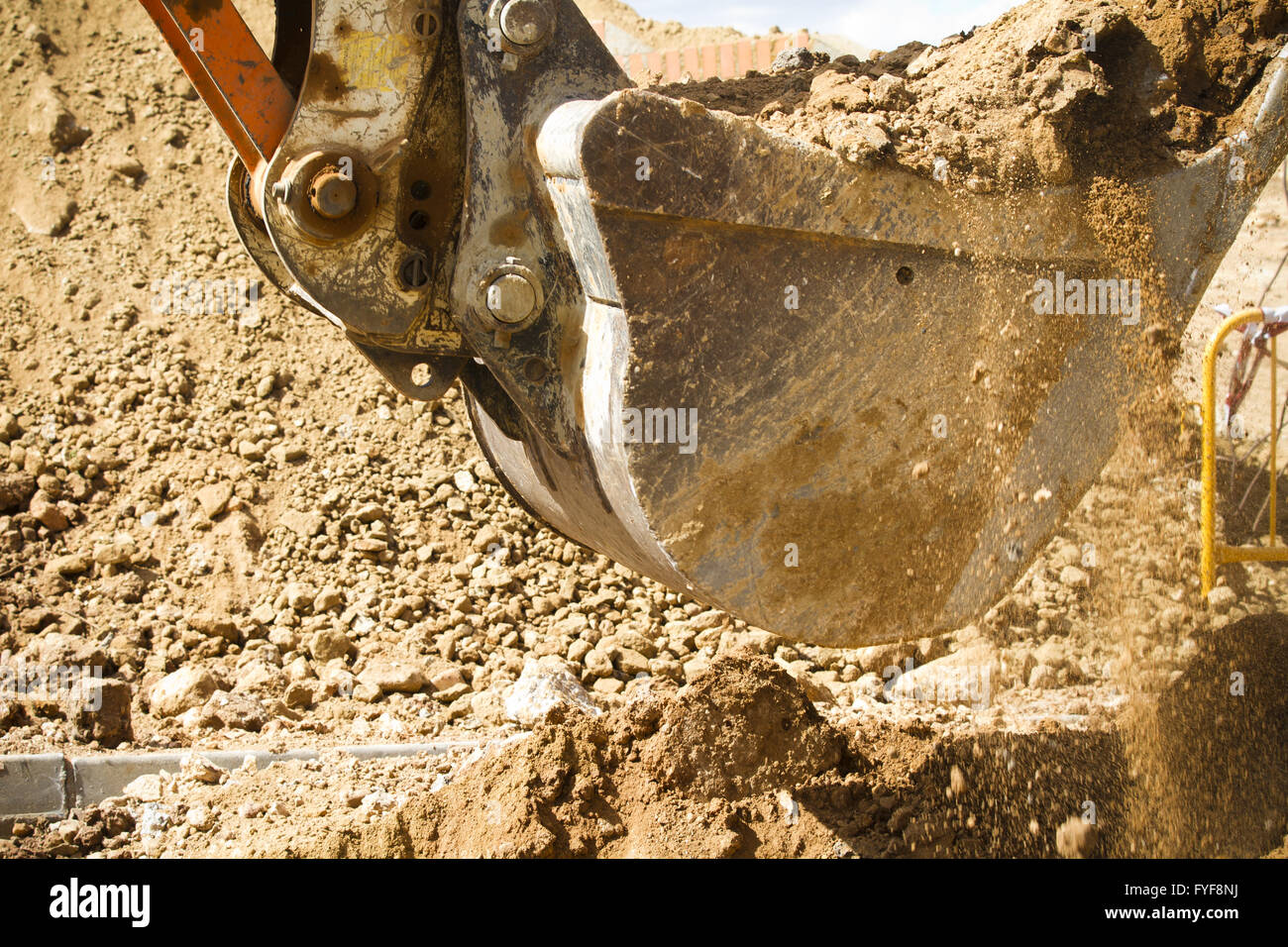 Wheel loader machine unloading sand at eathmoving works in construction ...