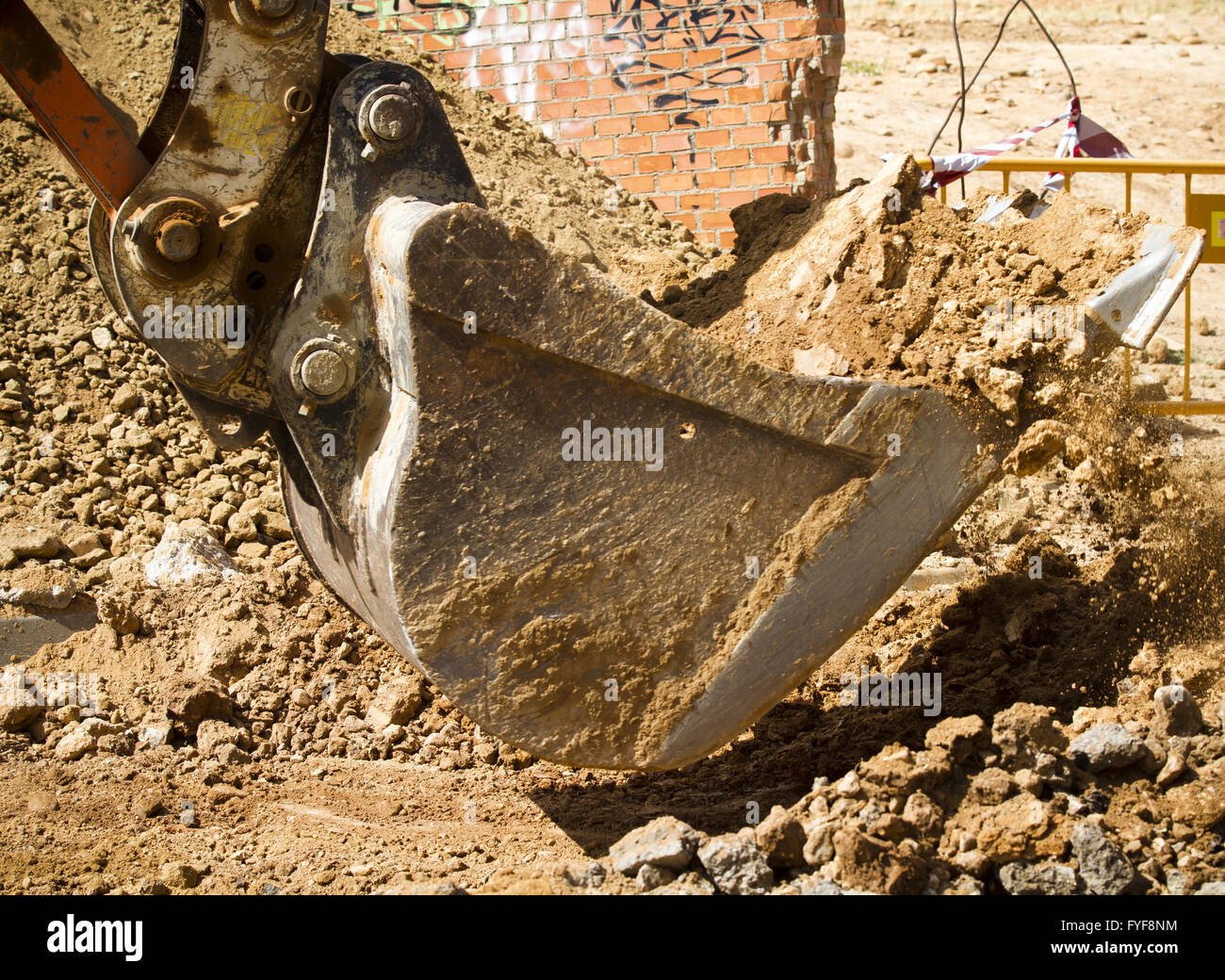 Excavator digging a deep trench Stock Photo - Alamy