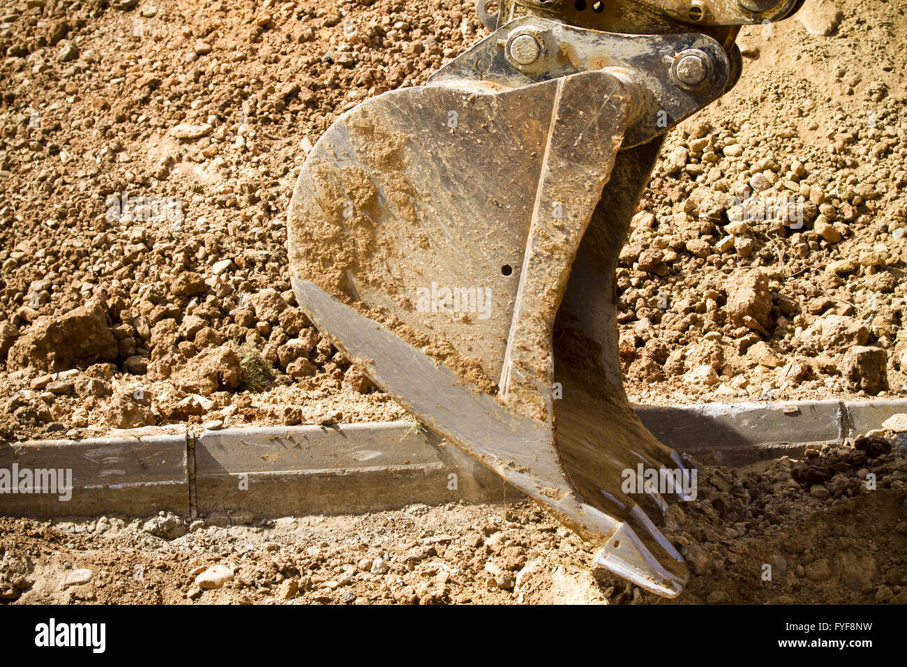Excavator digging a deep trench, working Stock Photo - Alamy