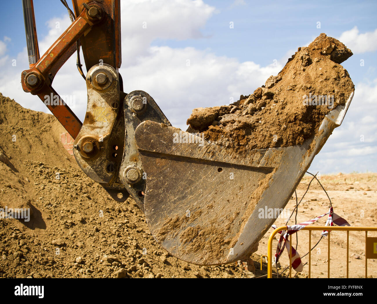 Excavator digging a deep trench, working, sand Stock Photo - Alamy
