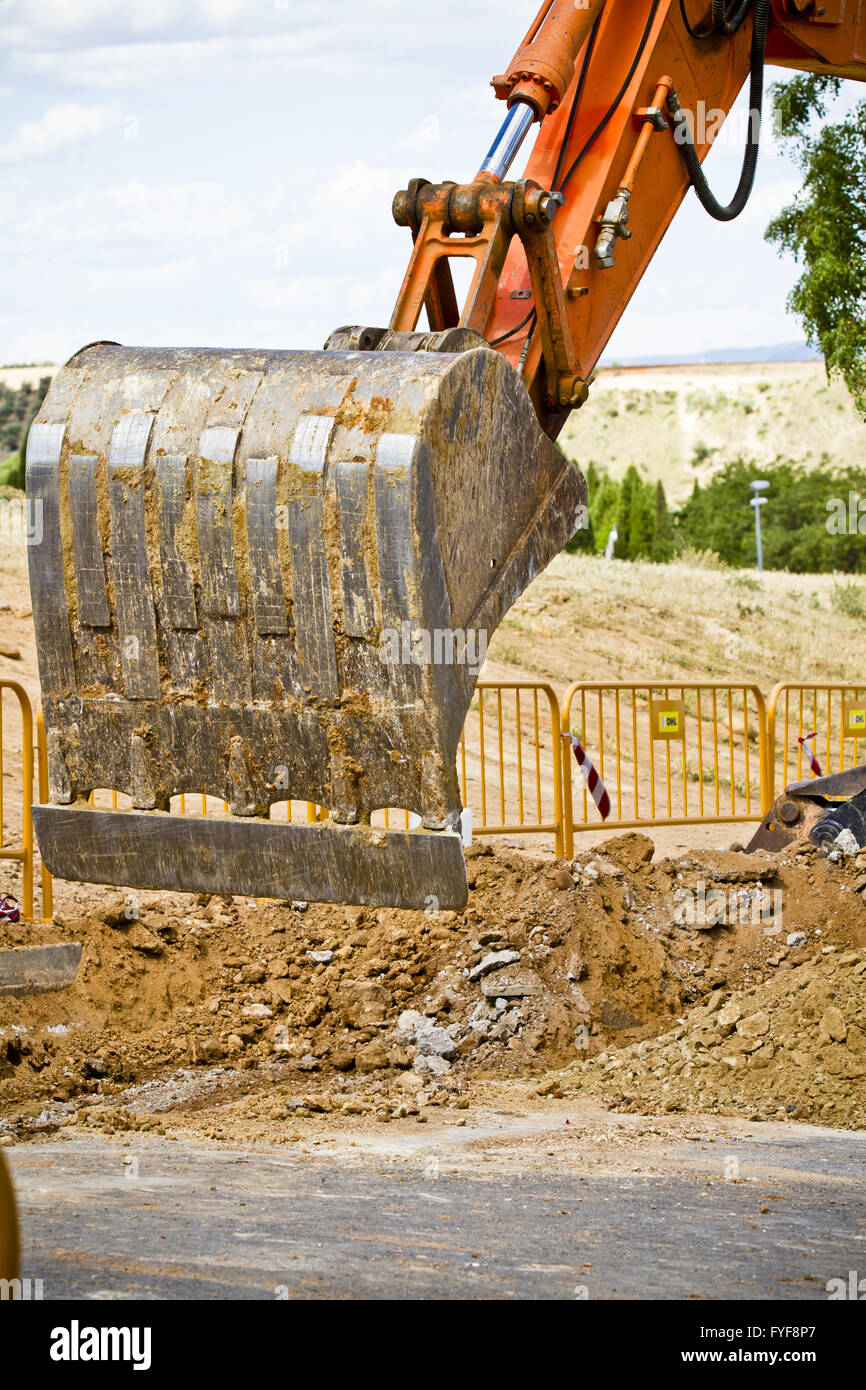 Wheel loader machine unloading sand at eathmoving works in construction ...