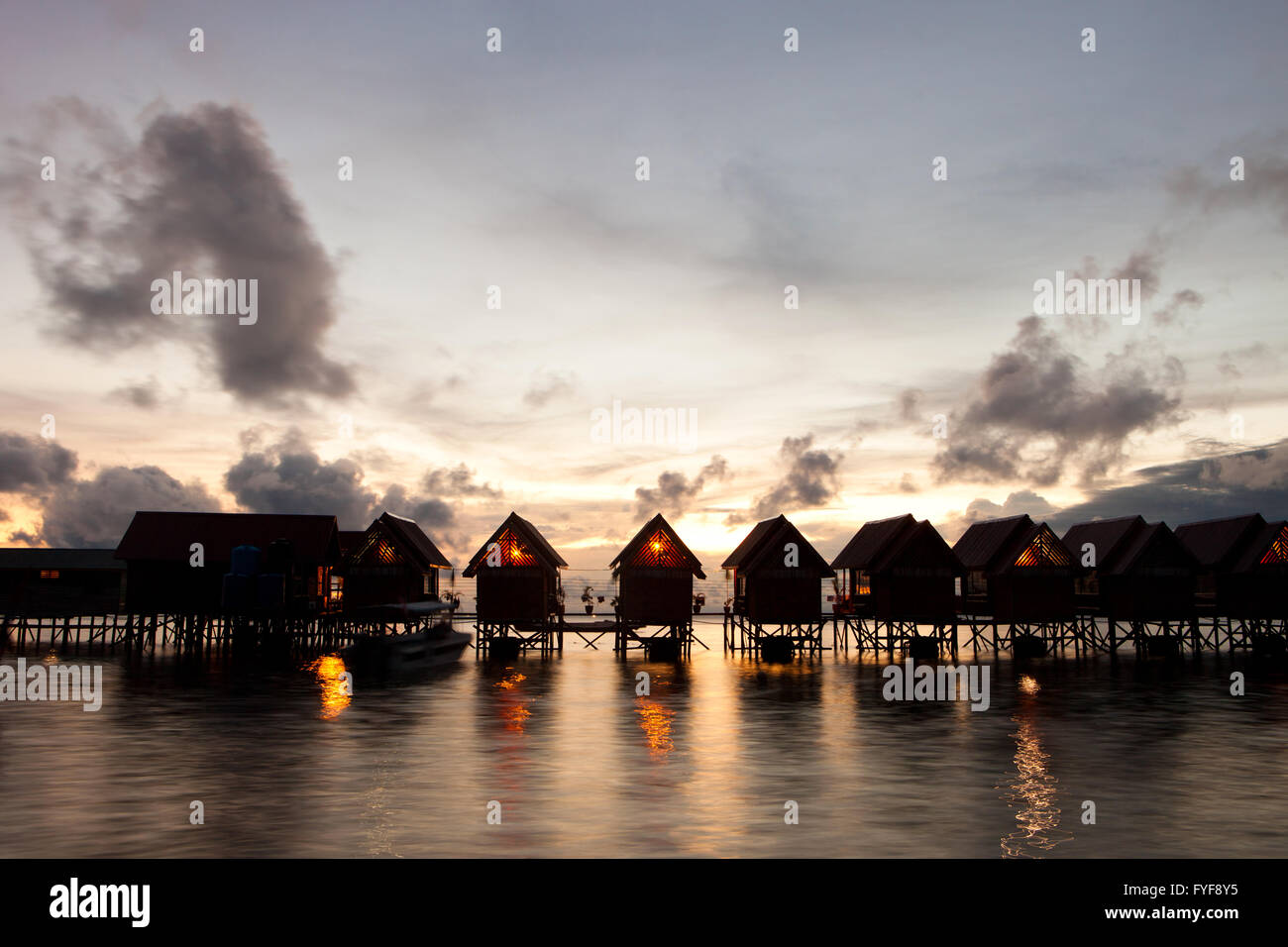 Sunset over coastline Stock Photo - Alamy