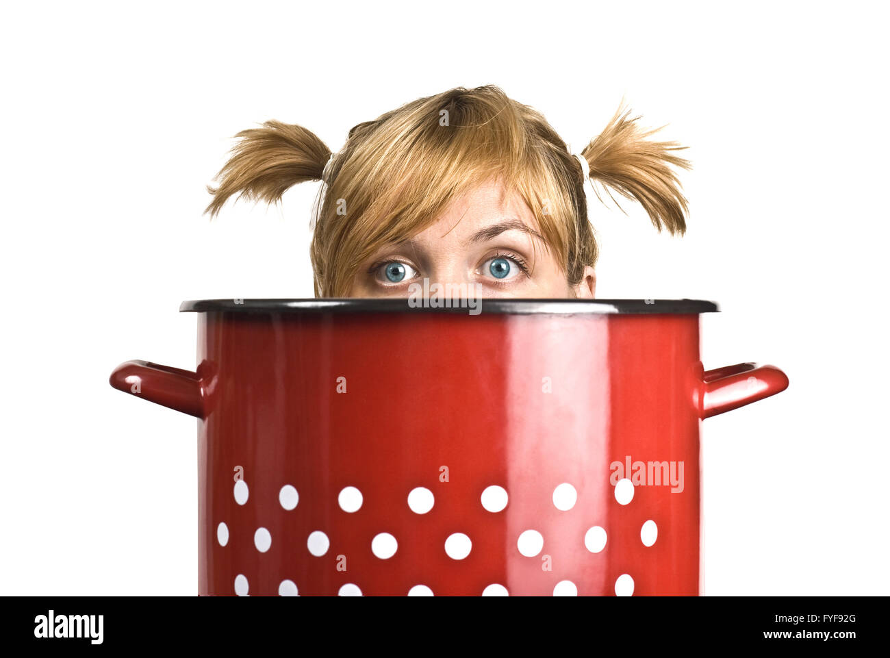 Horizontal portrait of a young blonde woman’s head coming out of a red ...