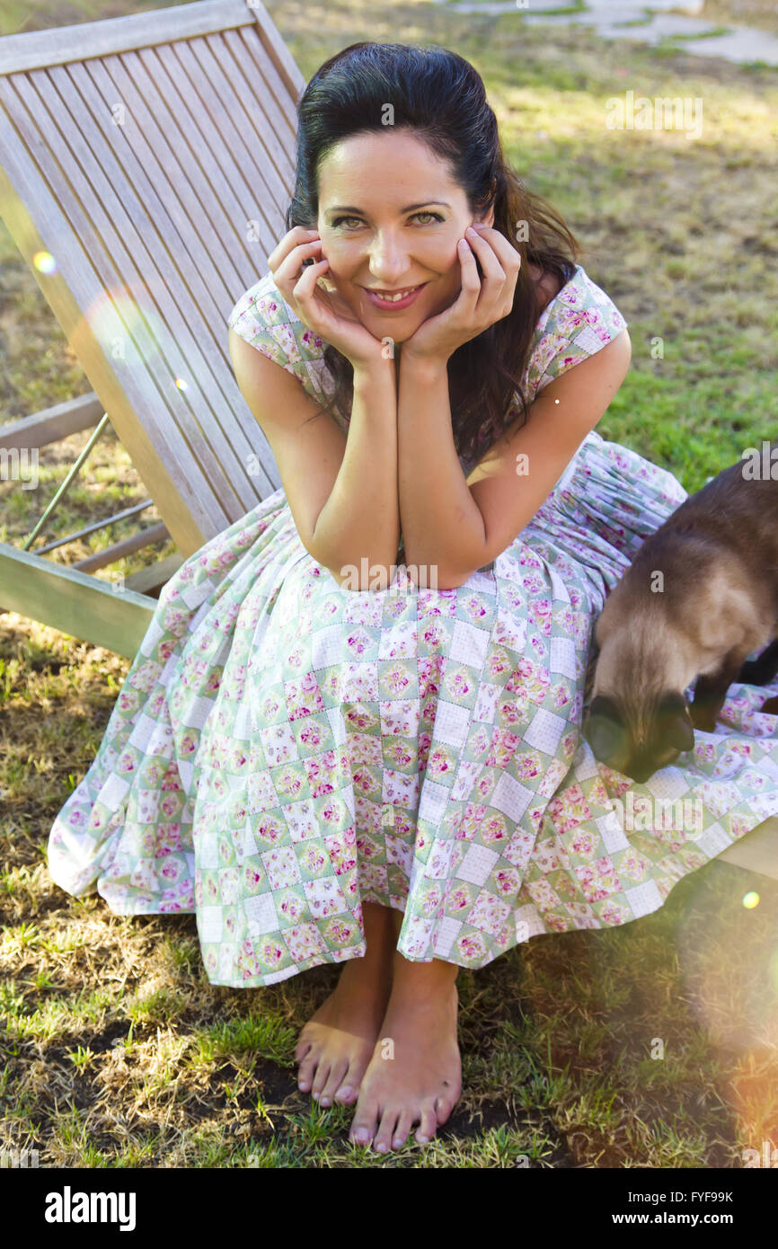 romantic young woman in spring with siamese cat Stock Photo - Alamy