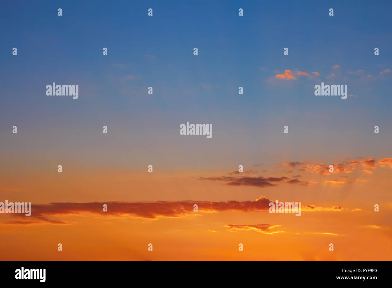 Multicolor clouds at sunset Stock Photo - Alamy