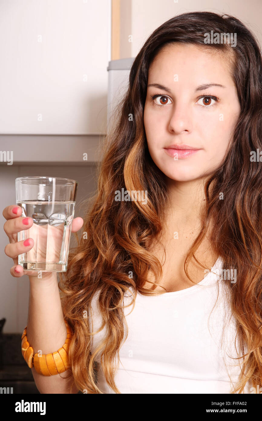 Young woman drinking water Stock Photo - Alamy