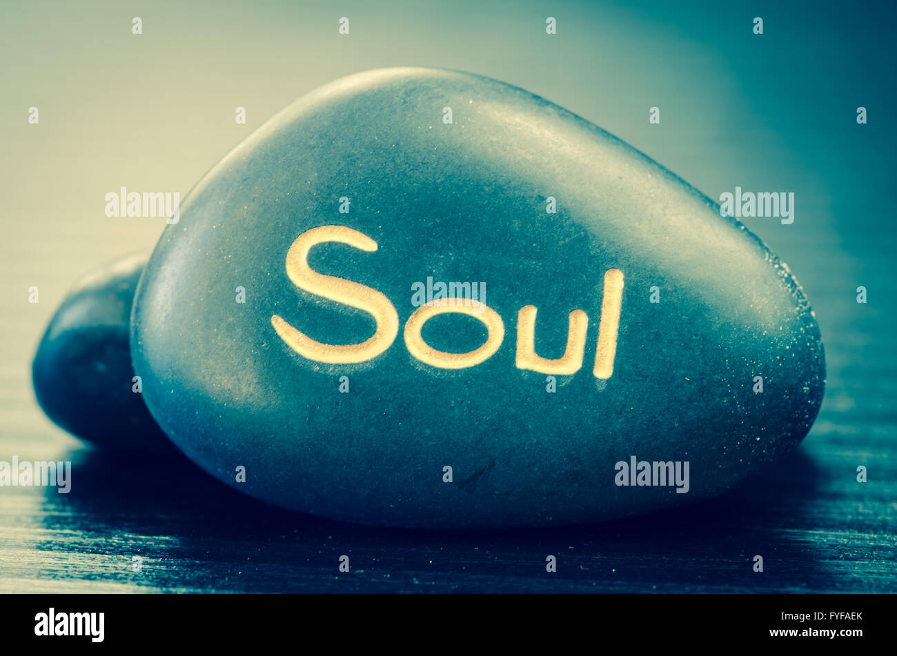 black lava stone with words soul Stock Photo - Alamy