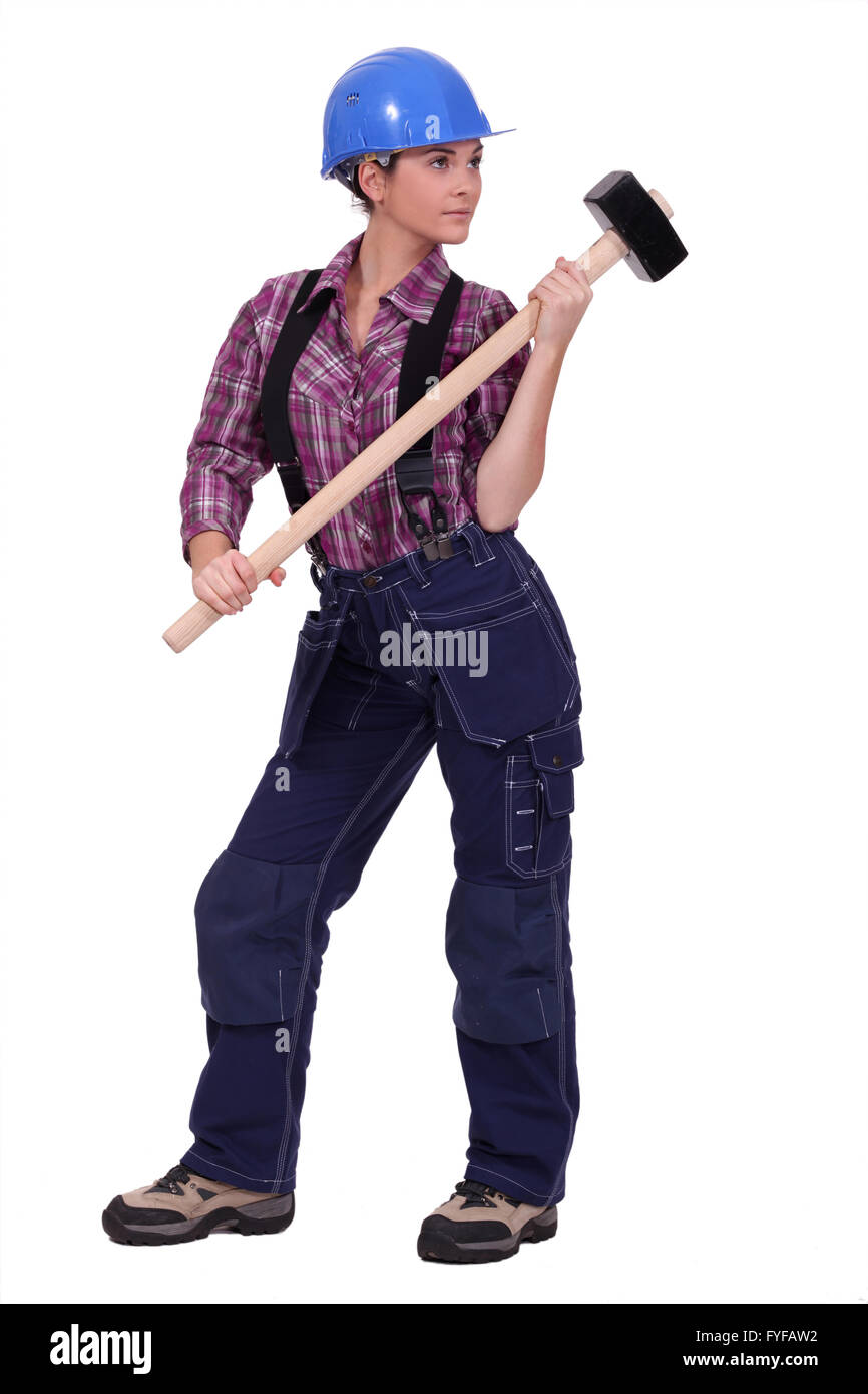 Female construction worker holding a rubber mallet Stock Photo - Alamy