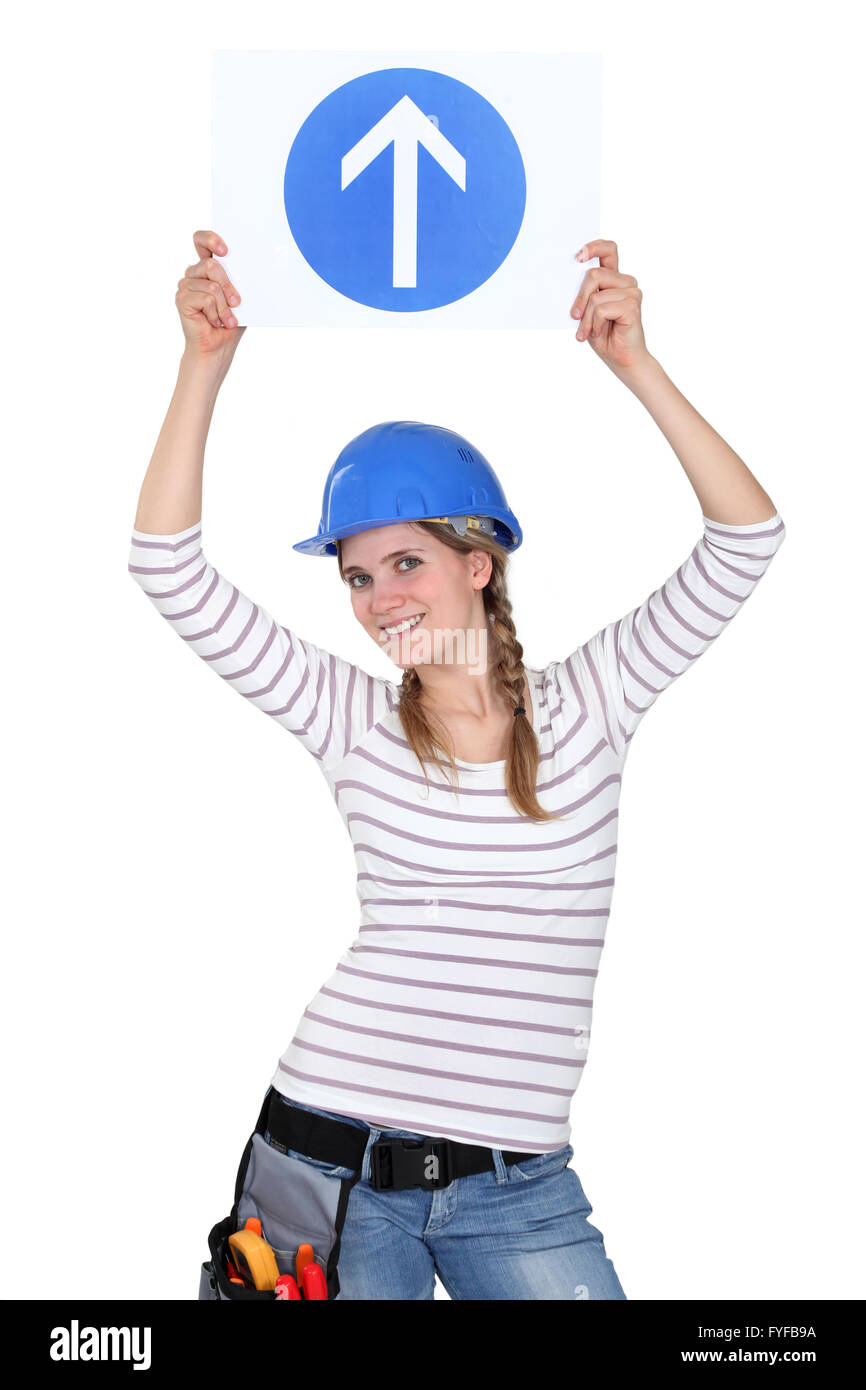 Female construction worker with an arrow pointing up Stock Photo - Alamy