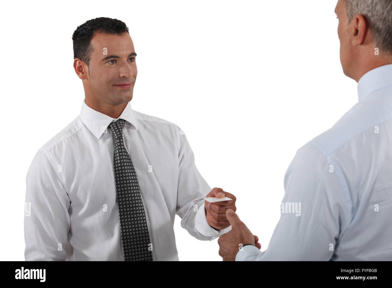 Man handing over his business card to a potential client Stock Photo ...