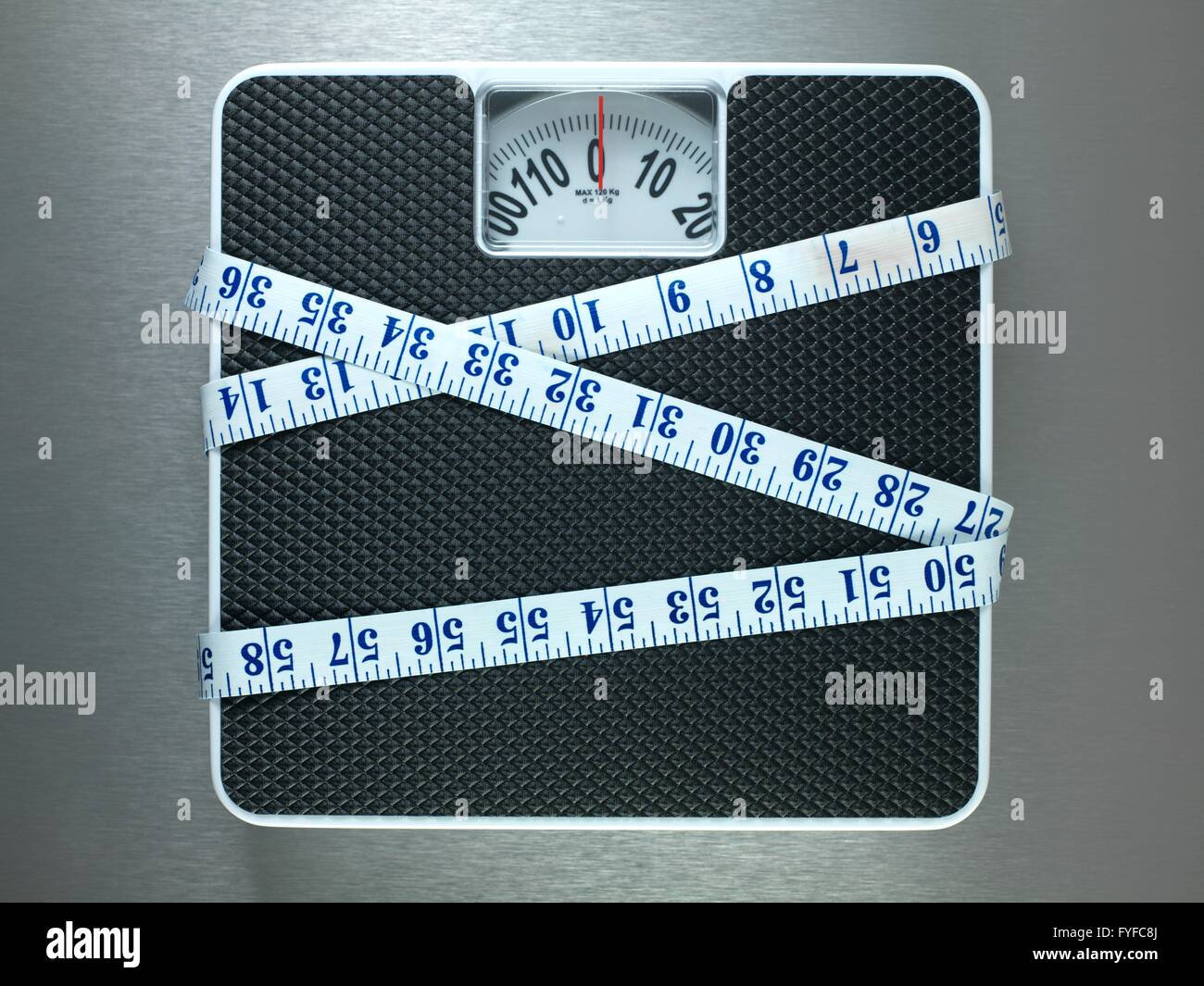 Bathroom scales isolated against a metallic background Stock Photo - Alamy
