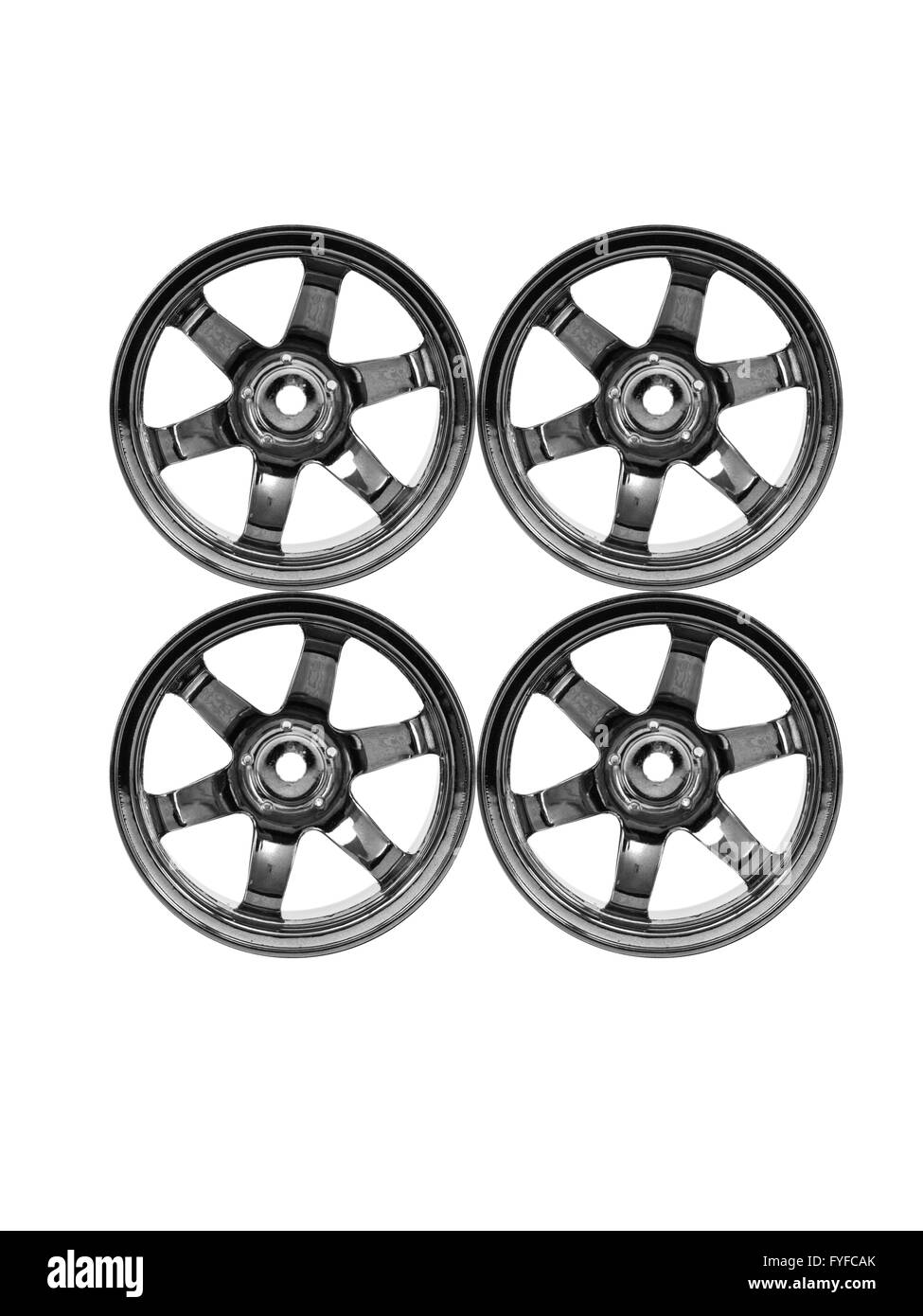 Rubber tyres with sports rims on a white background Stock Photo - Alamy