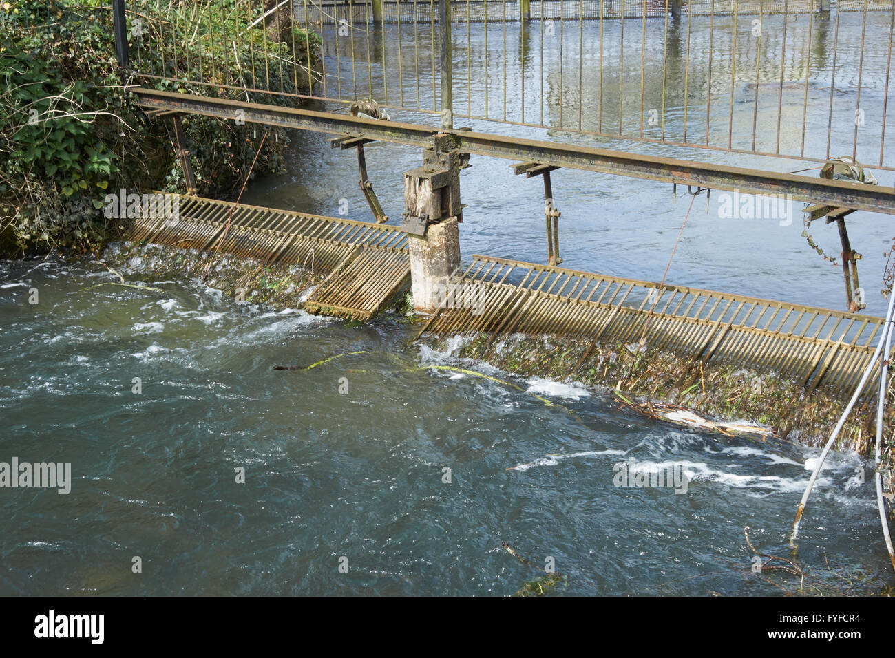 Metal grid across river to catch debris. UK Stock Photo - Alamy