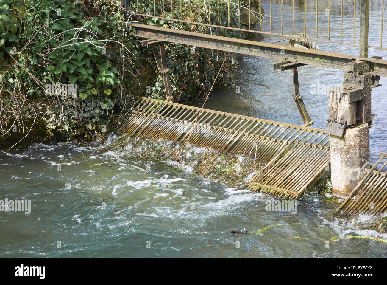 Metal grid across river to catch debris. UK Stock Photo - Alamy