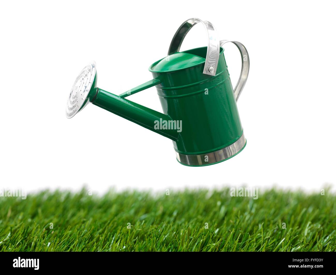 A watering can isolated against a white background Stock Photo - Alamy