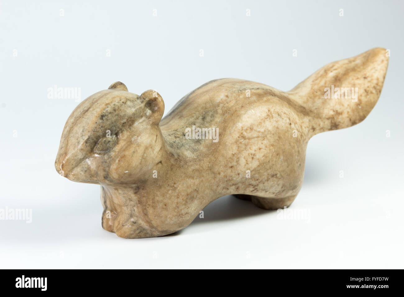 stone statue of a badger on a white background Stock Photo - Alamy