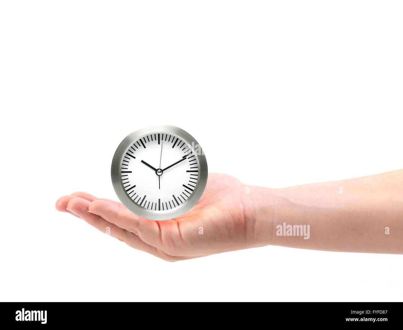 A female hand holding a clock isolated against a white background Stock ...