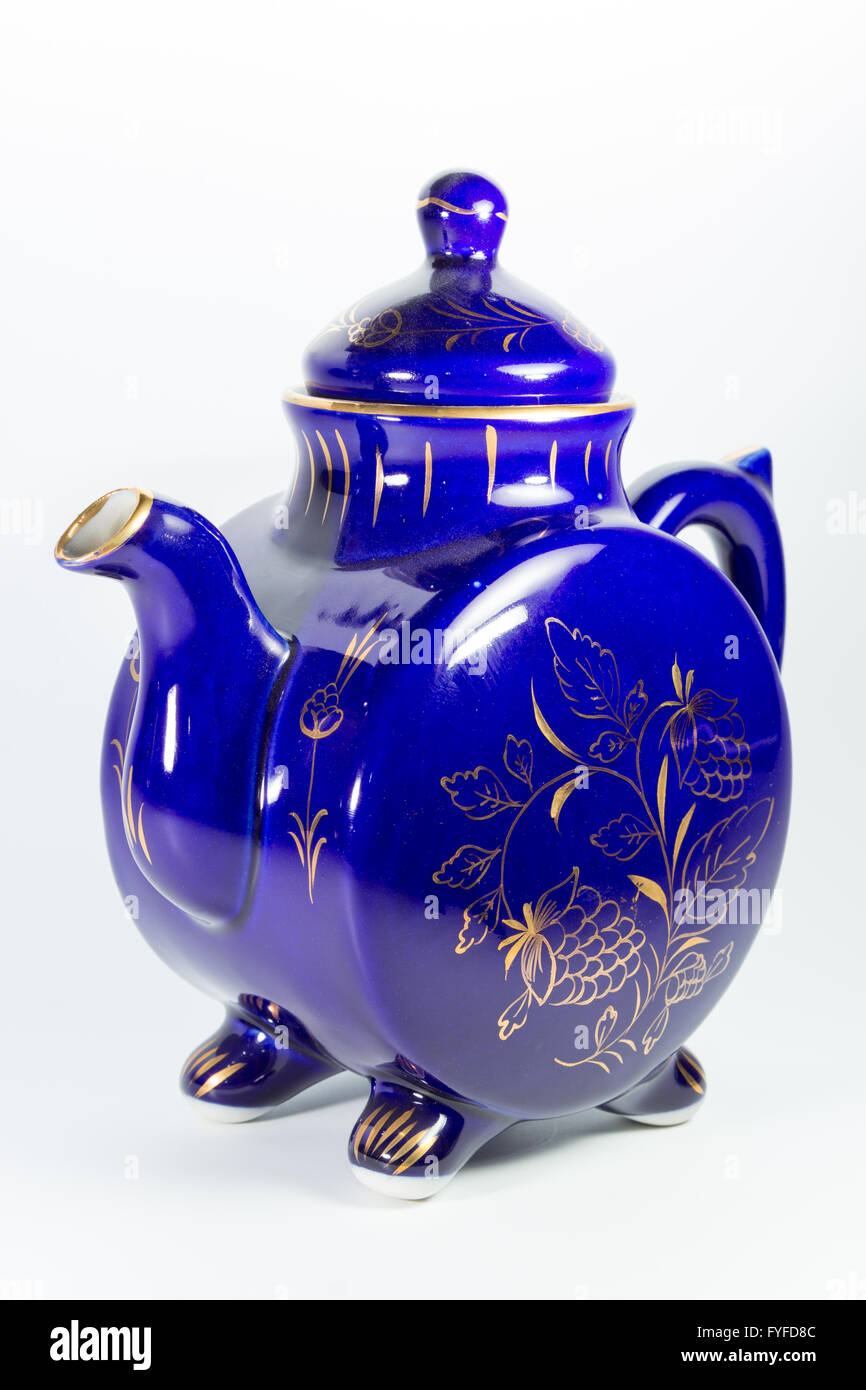blue porcelain teapot on a white background Stock Photo - Alamy