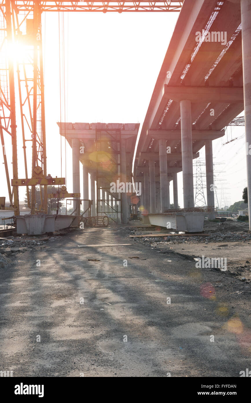 concrete highway under construction against the sun vertical Stock ...