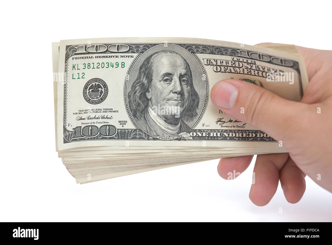hand holding stacks of 100 USD paper currency on white with clipping ...