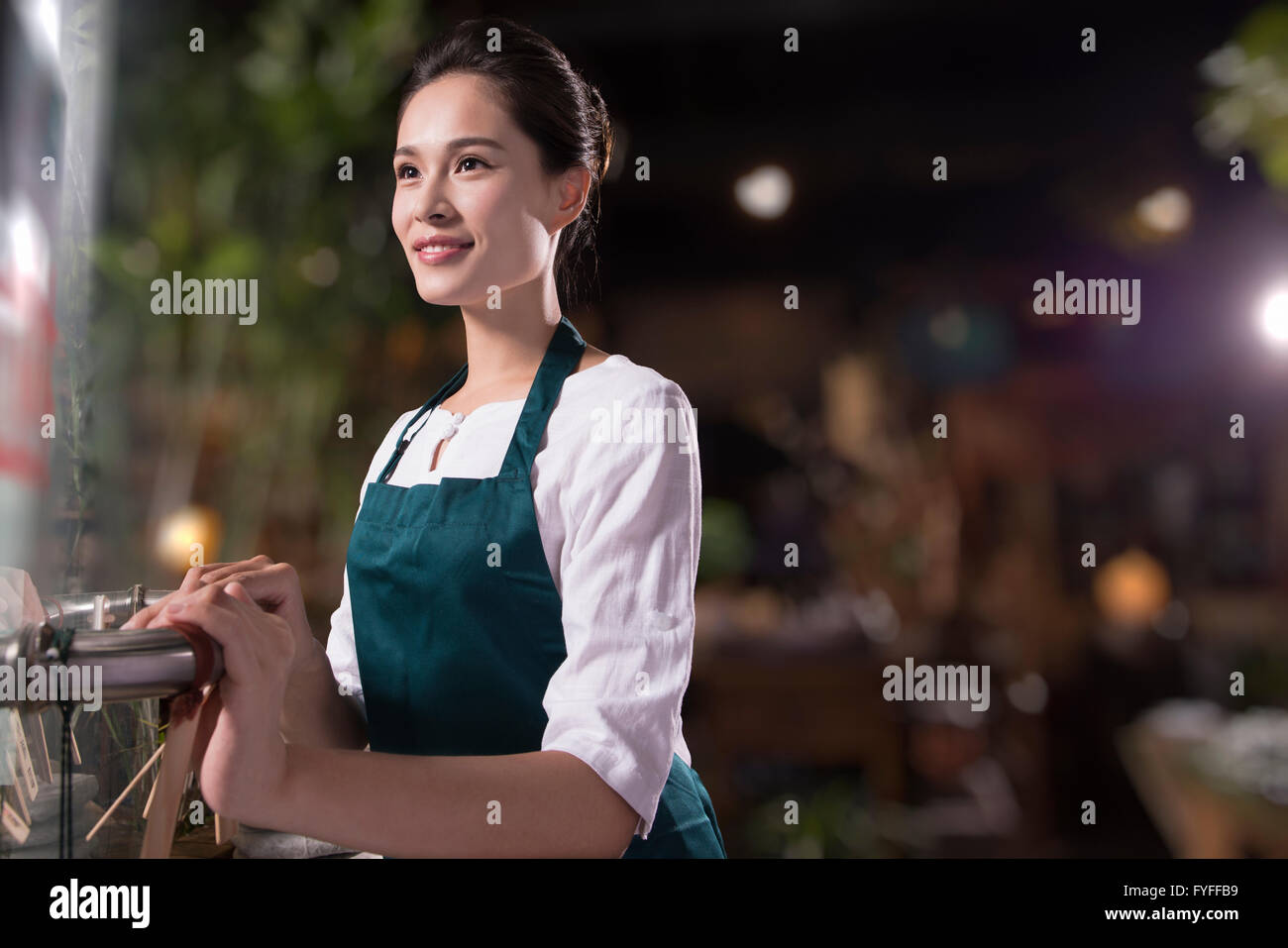 Tea house owner opening door Stock Photo - Alamy