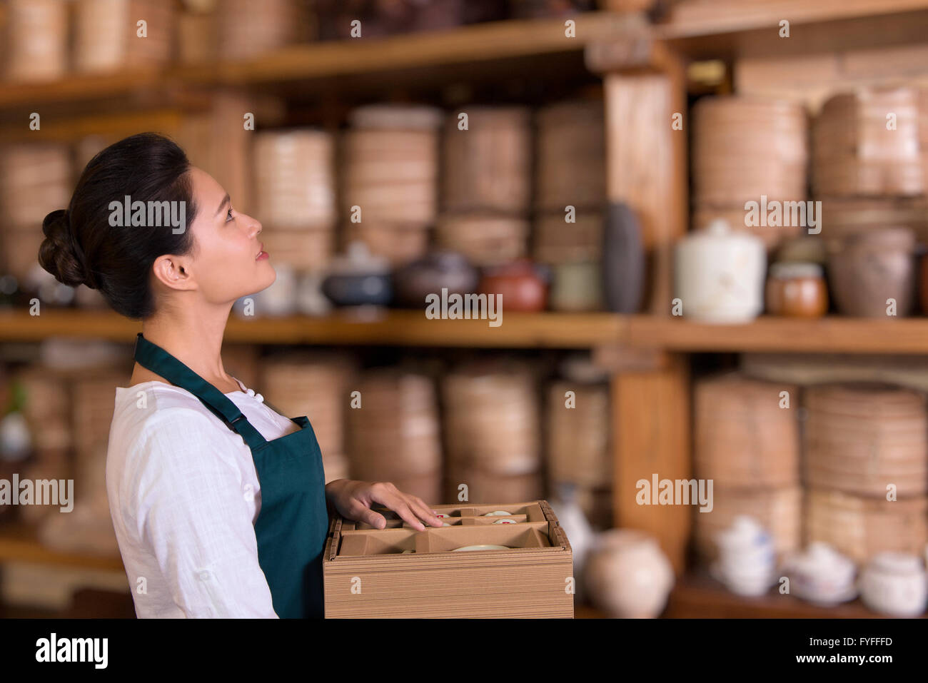 Tea house owner checking inventory Stock Photo - Alamy