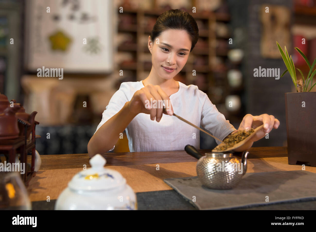 Tea house owner preparing tea Stock Photo - Alamy