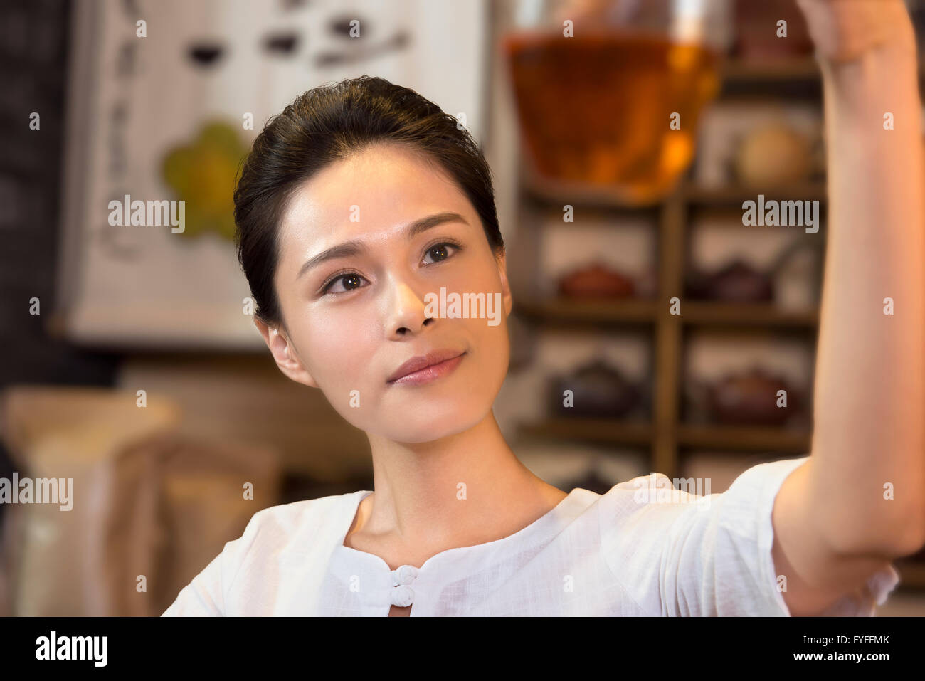 Tea house owner making tea Stock Photo - Alamy