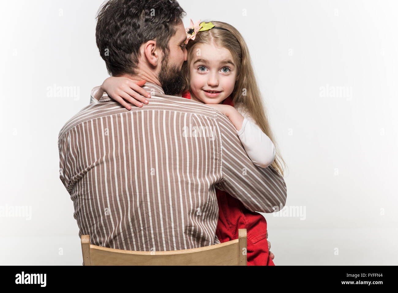 Girl hugging her father over a white background Stock Photo - Alamy
