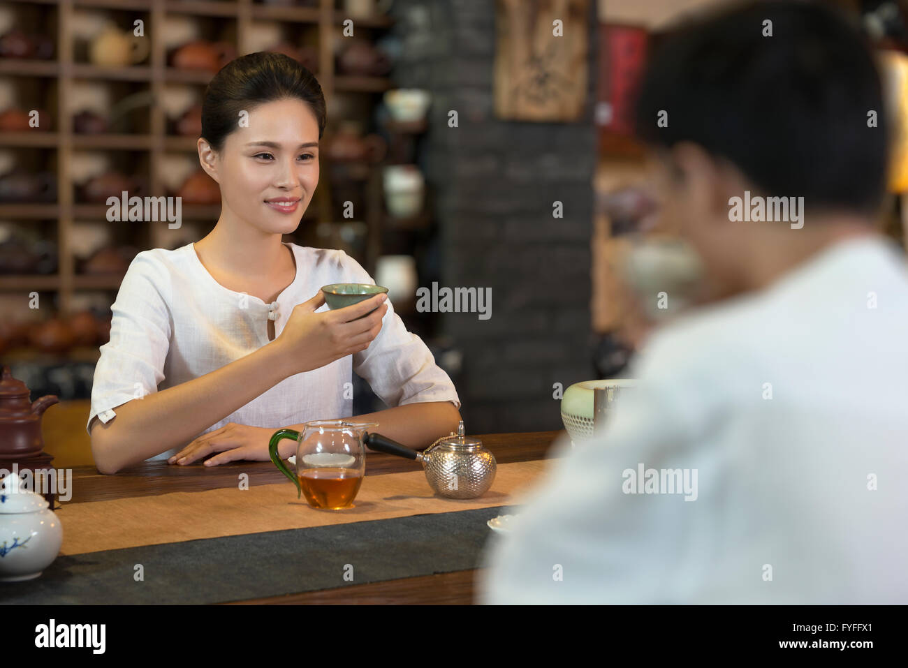 Friends drinking tea Stock Photo - Alamy