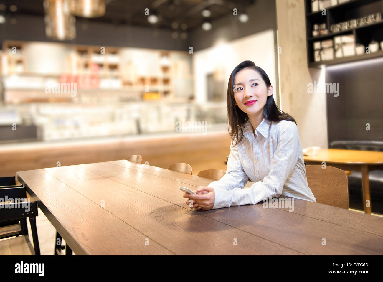 Bakery owner using smart phone Stock Photo - Alamy