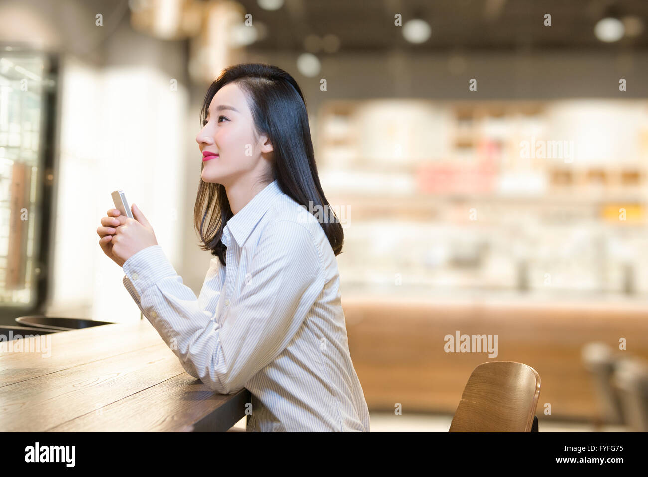 Bakery owner using smart phone Stock Photo - Alamy