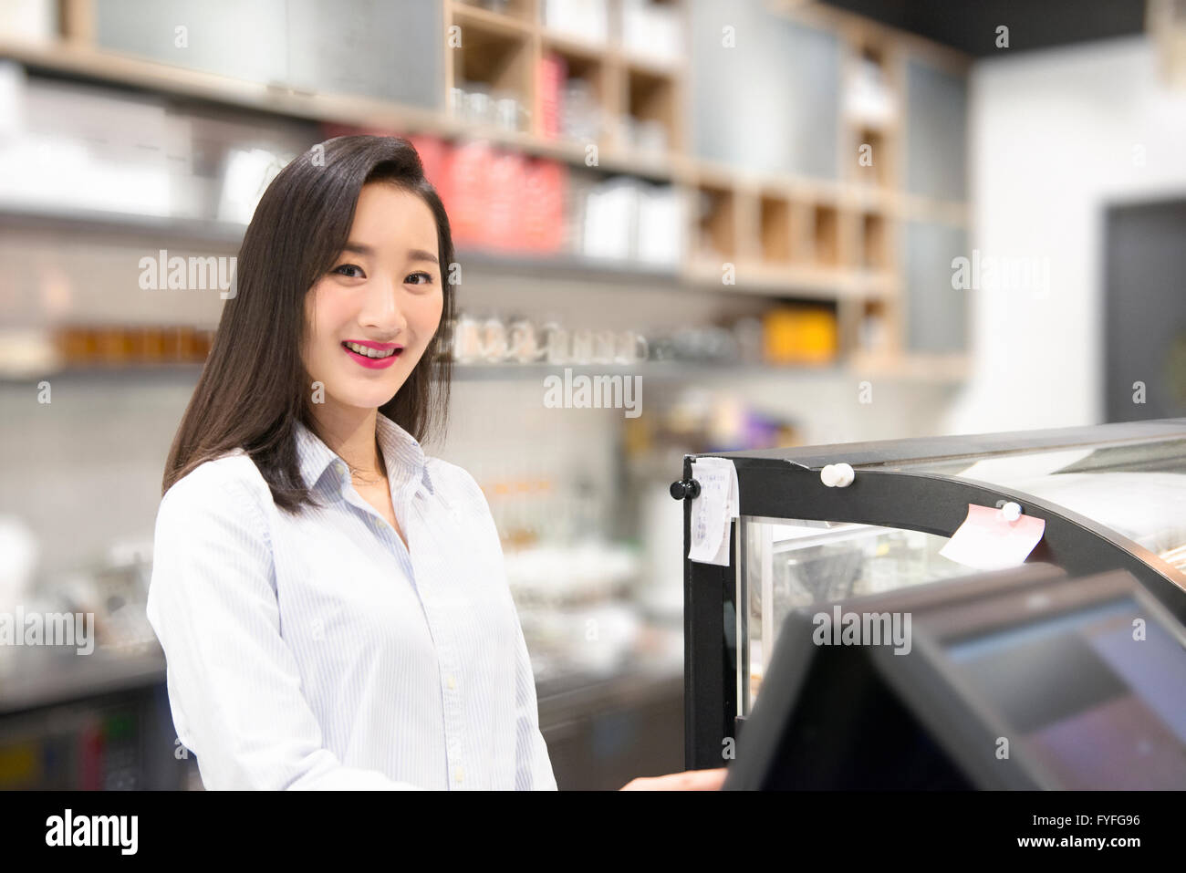Bakery owner at cashier Stock Photo - Alamy