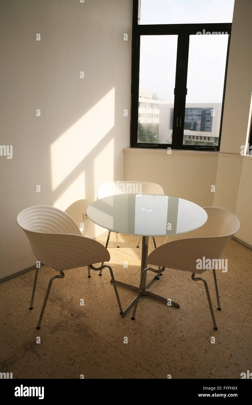 Chair beside the table Stock Photo - Alamy