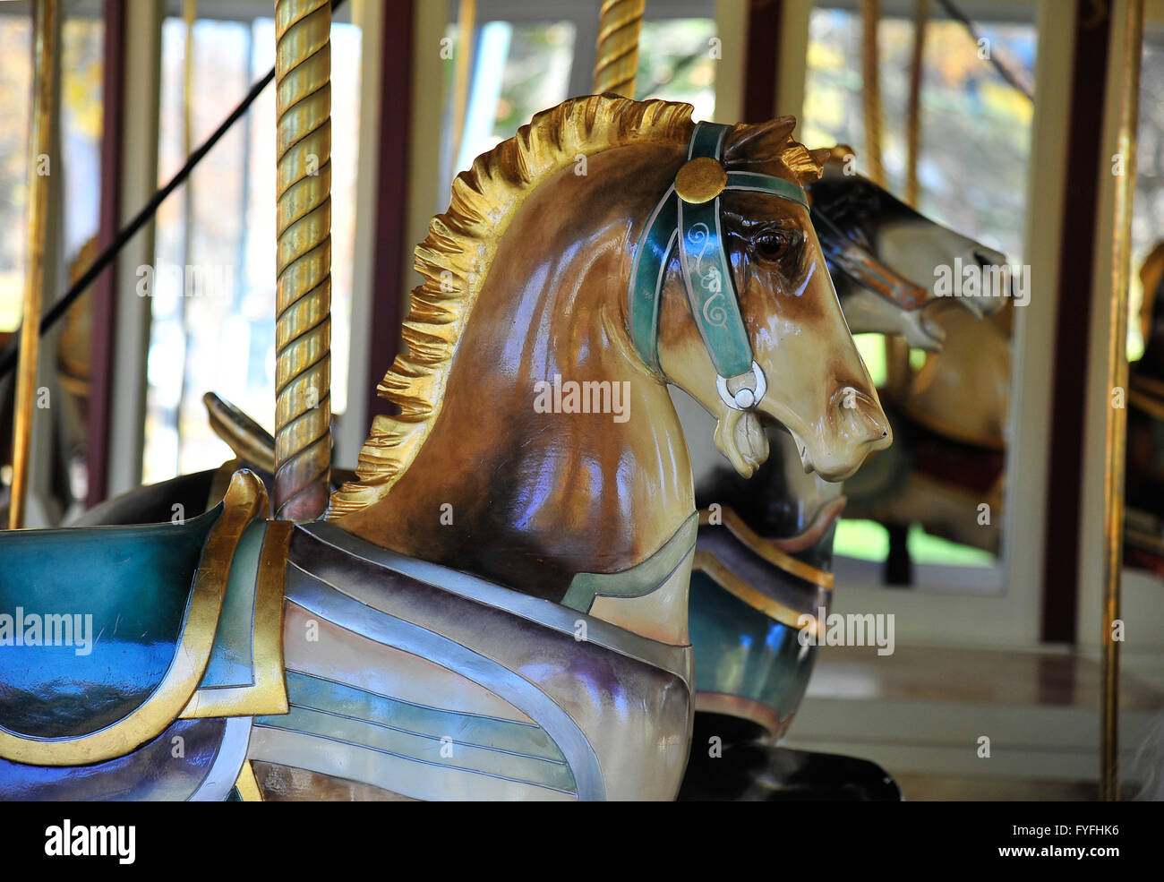 Children's roundabout, nostalgic carousel with wooden horses from 1910 ...