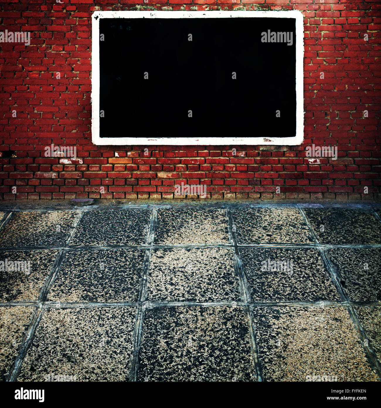 chalkboard with brick wall as background Stock Photo - Alamy