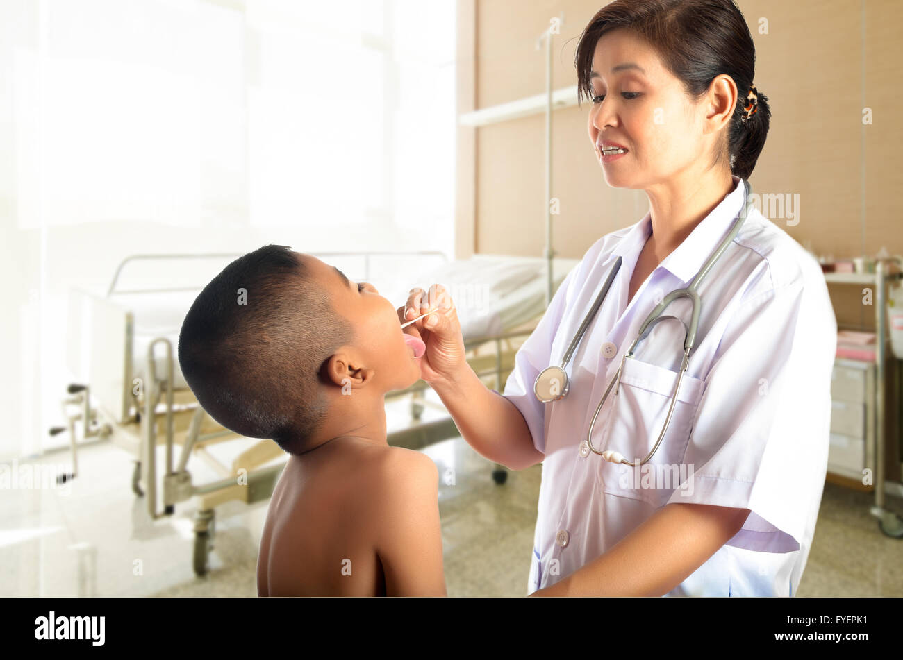 doctor examines a boy Stock Photo - Alamy