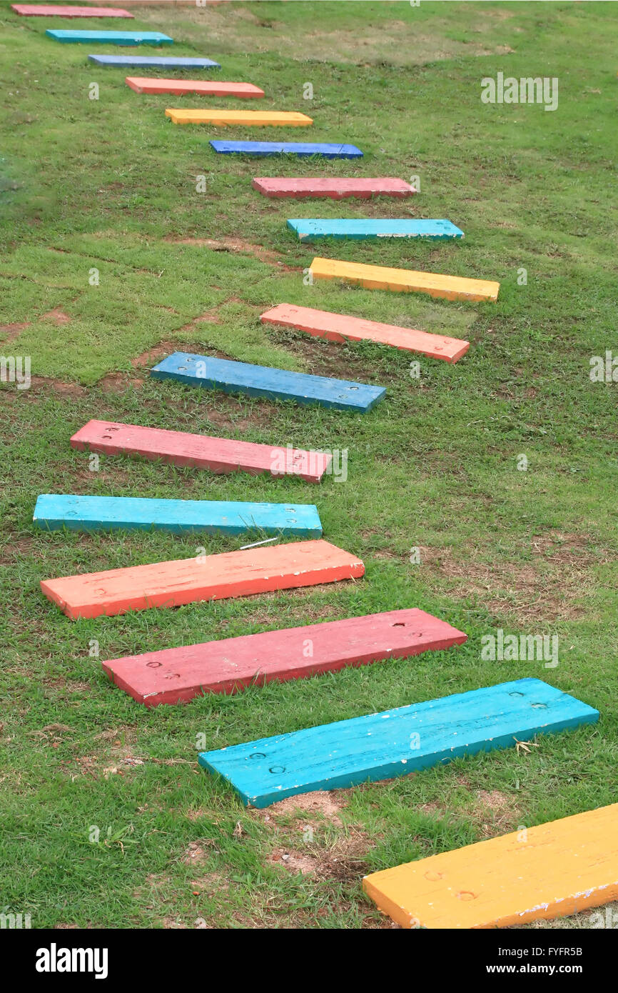 Colorful Wooden Walkway and Pathway in the Green garden grass fields ...