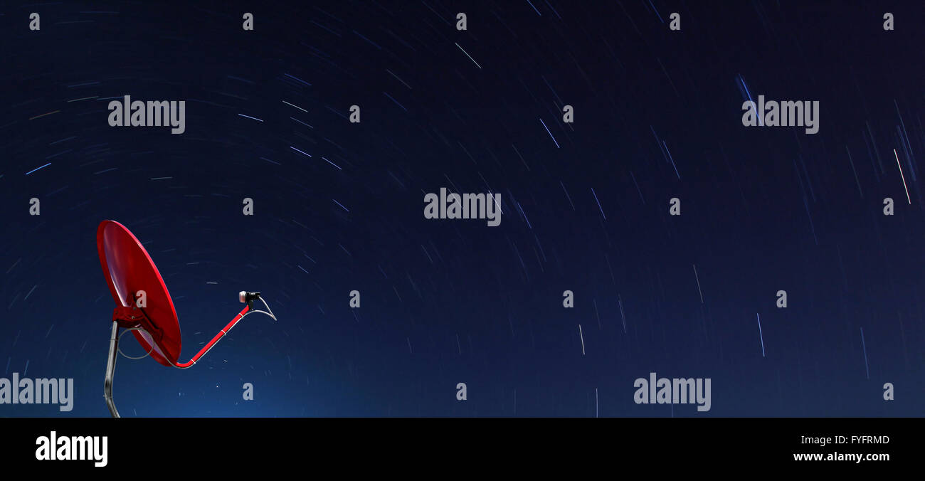 Conceptual of Red satellite over spiral star at night Stock Photo - Alamy