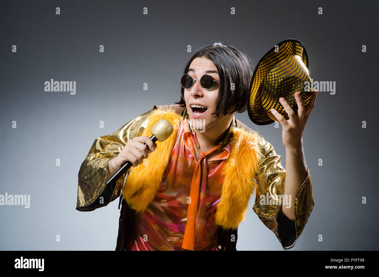 Young man singing in karaoke club Stock Photo - Alamy