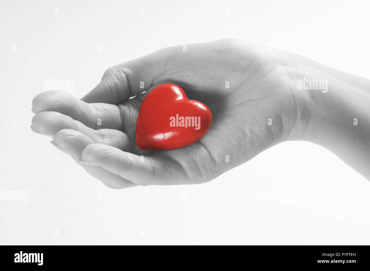 Hand giving heart hi-res stock photography and images - Alamy