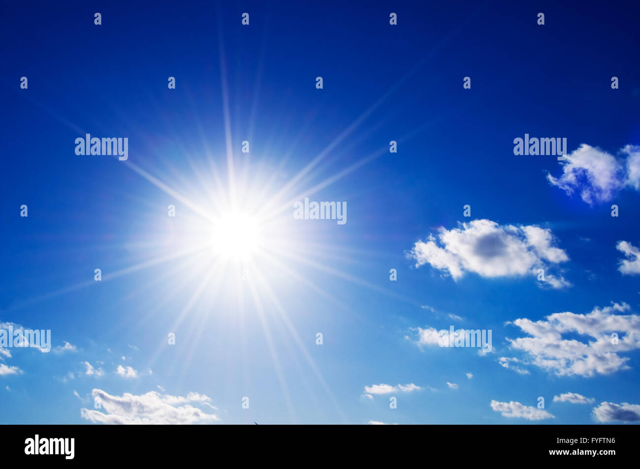 Sunny blue sky with fluffy clouds Stock Photo - Alamy